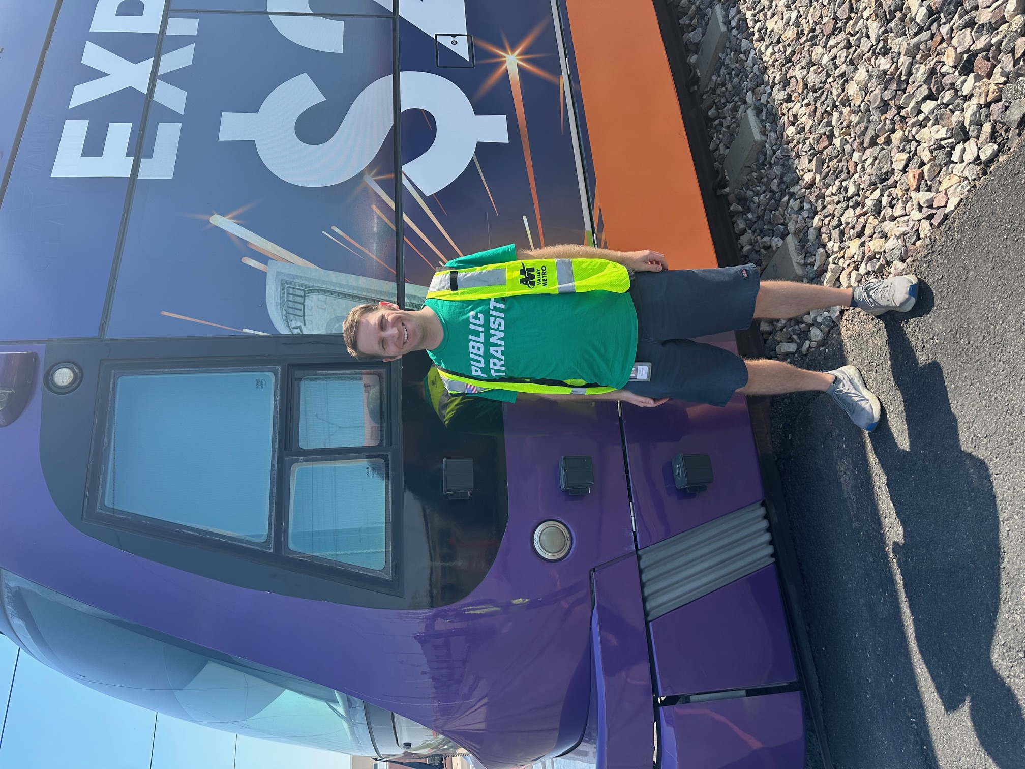 Kevin Fleischman standing alongside a Valley Metro Light Rail Vehicle