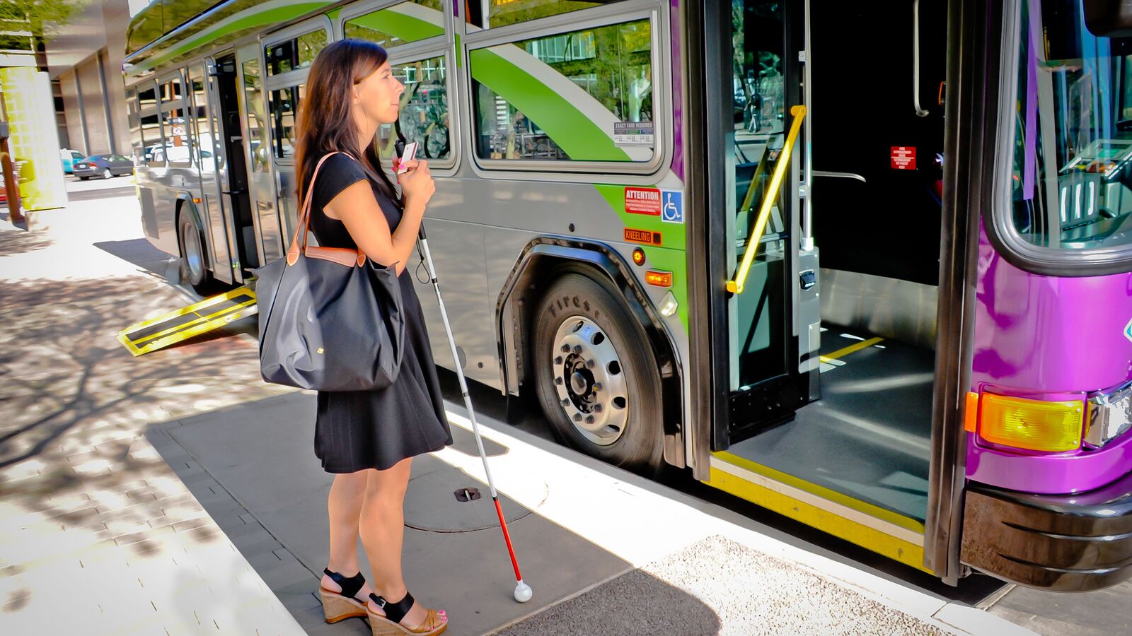 Woman with disability getting on bus